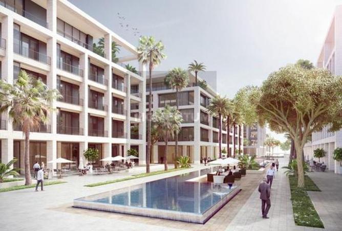 Sale in Al Burouj Compound: Ground floor apartment in Garden City, Club ...